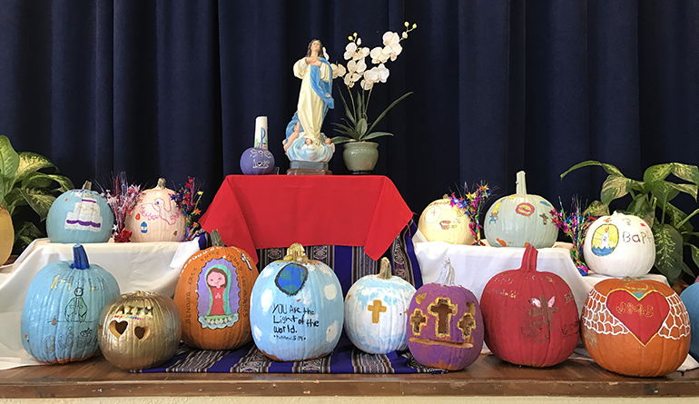 ADOM :: St. Michael School pumpkins display ‘light of the world’