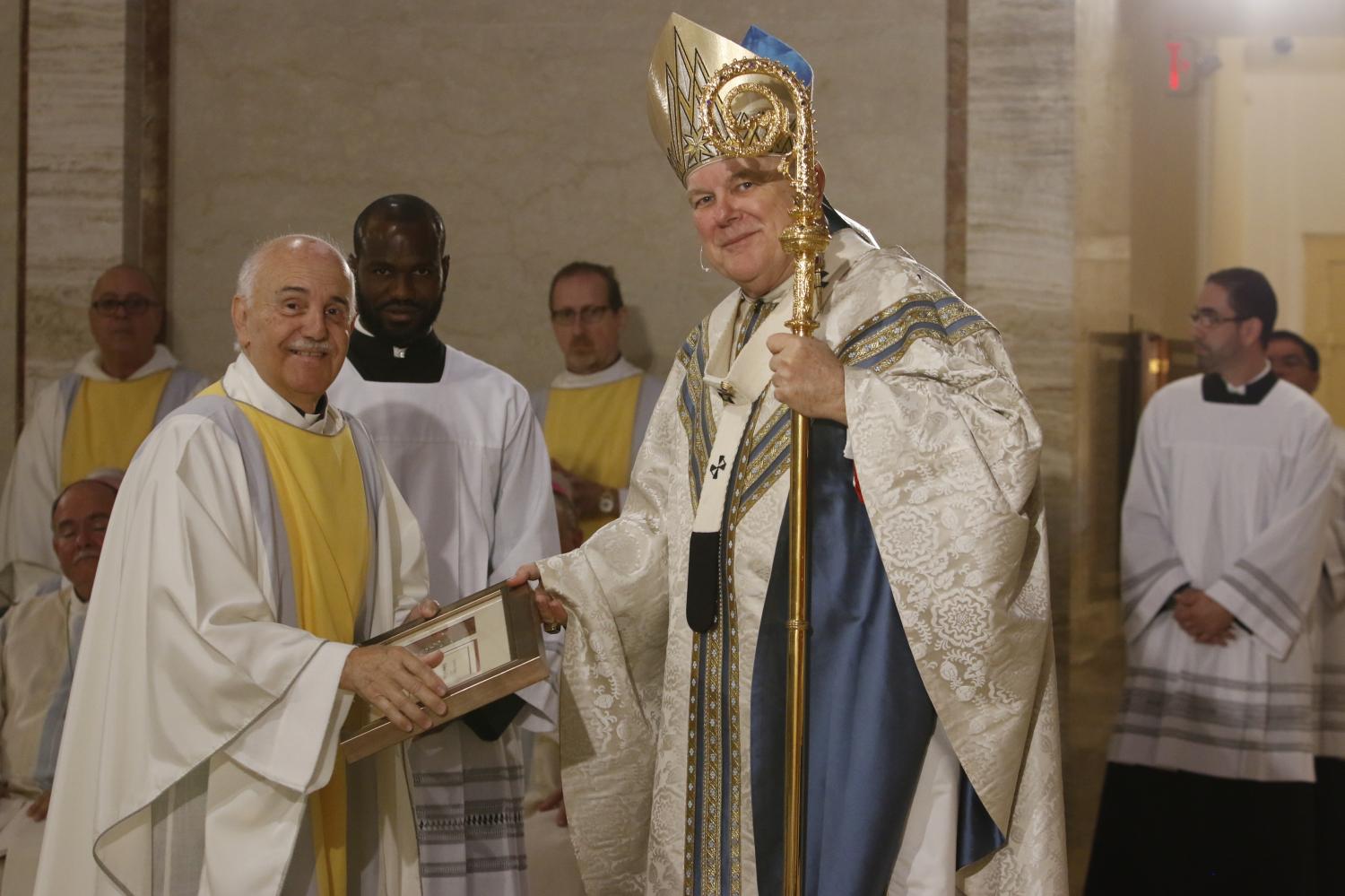 ADOM :: 14 priests honored at chrism Mass