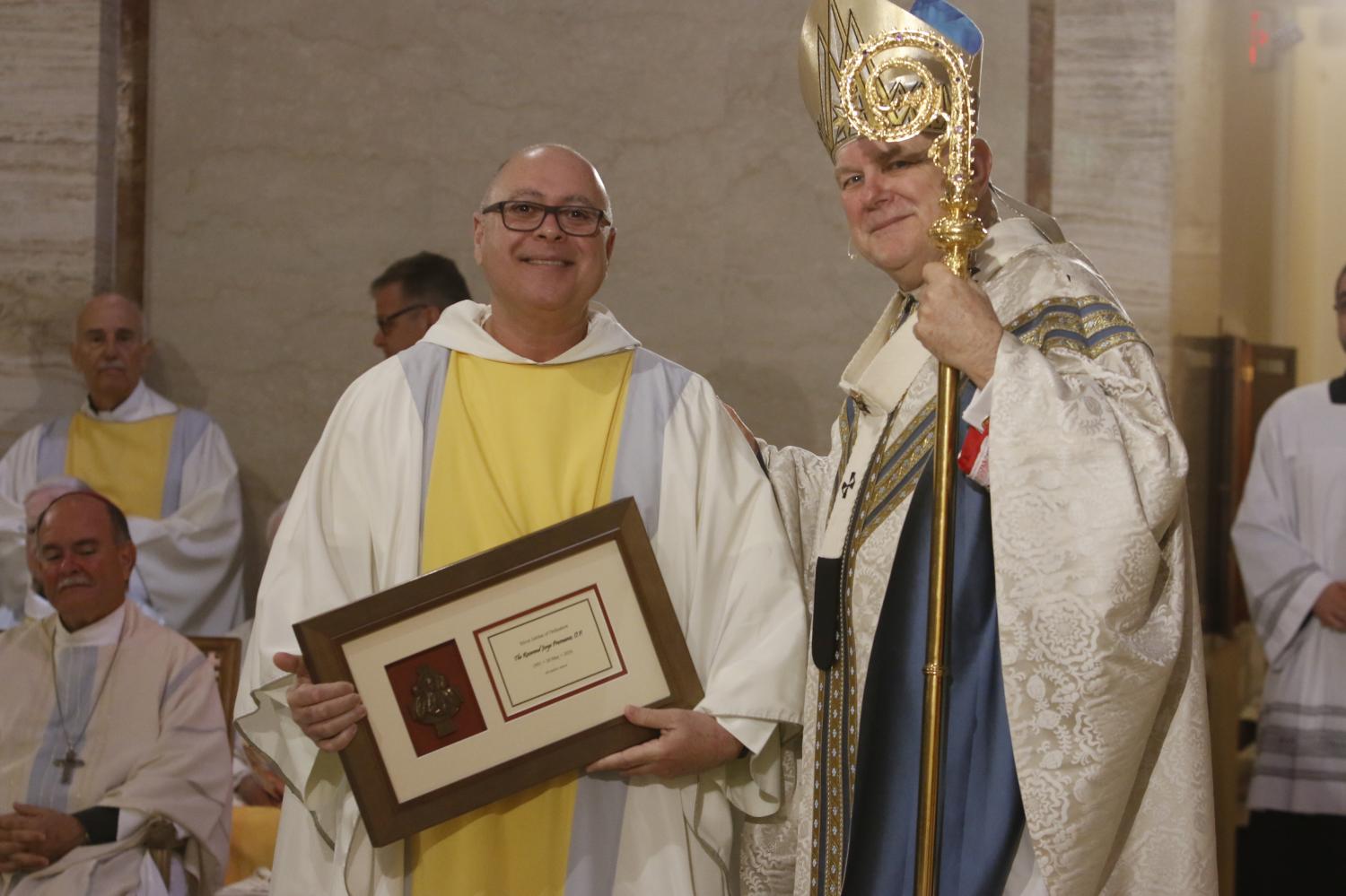 ADOM :: 14 priests honored at chrism Mass