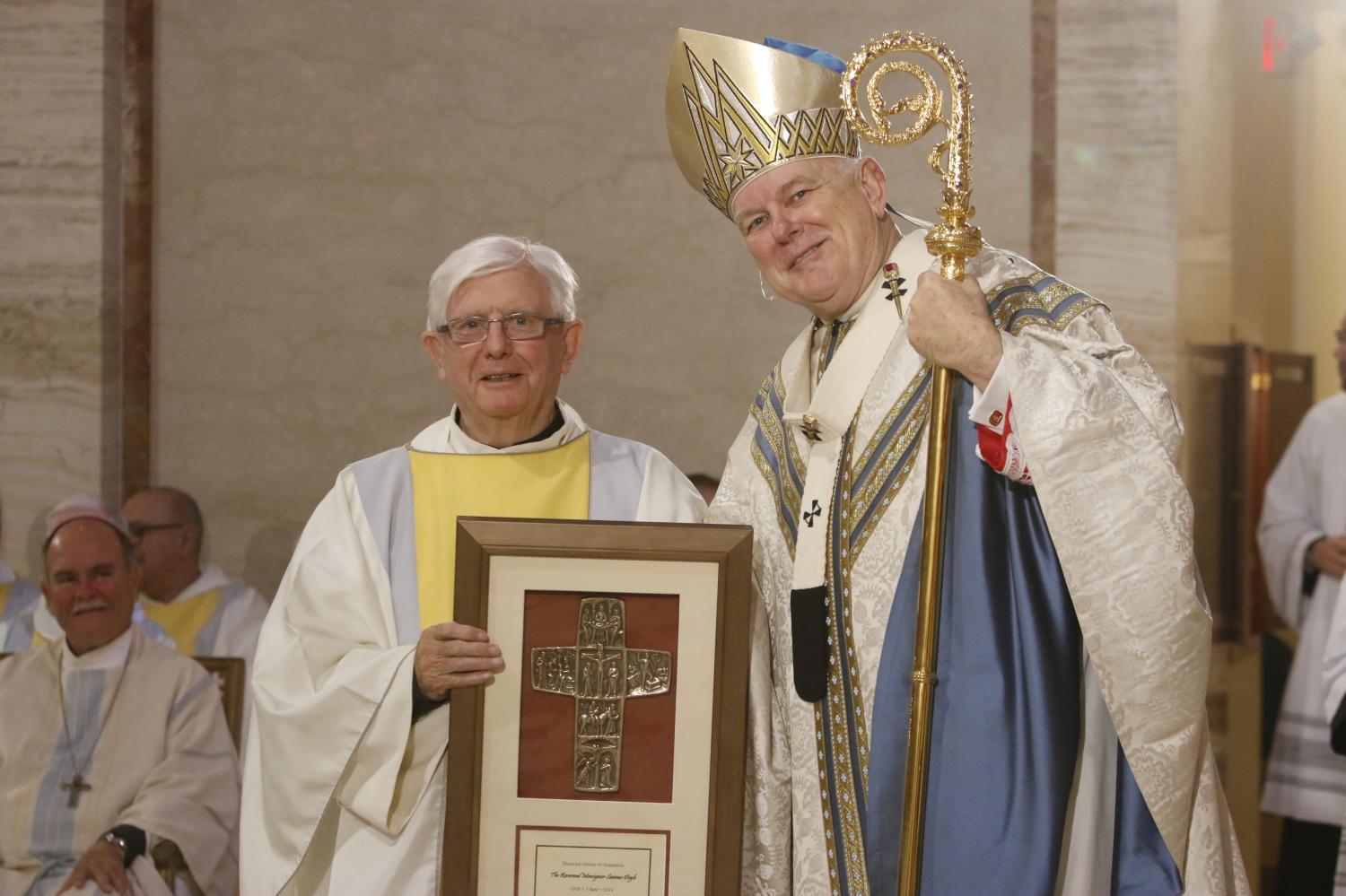 ADOM :: 14 priests honored at chrism Mass