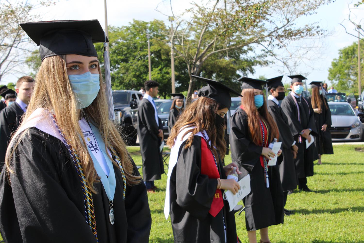 ADOM :: Caps, gowns, diplomas, and face masks